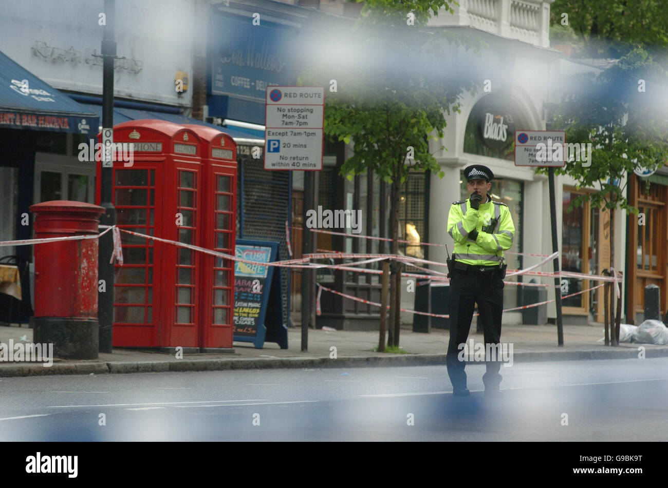 A Metropolitan police officer patrols close to Islington Green on Upper ...