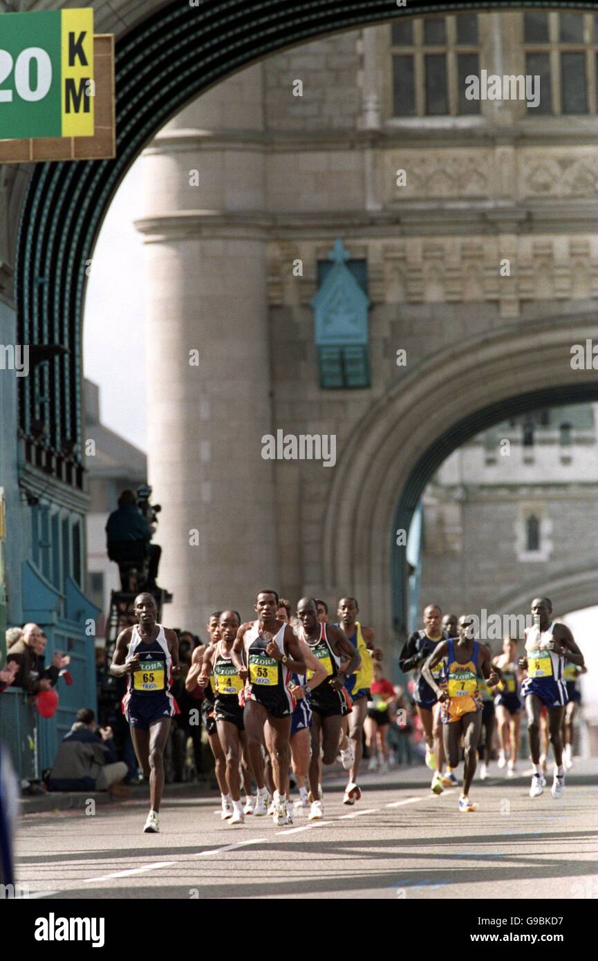 Athletics - Flora London Marathon. The leading pack cross London Bridge ...