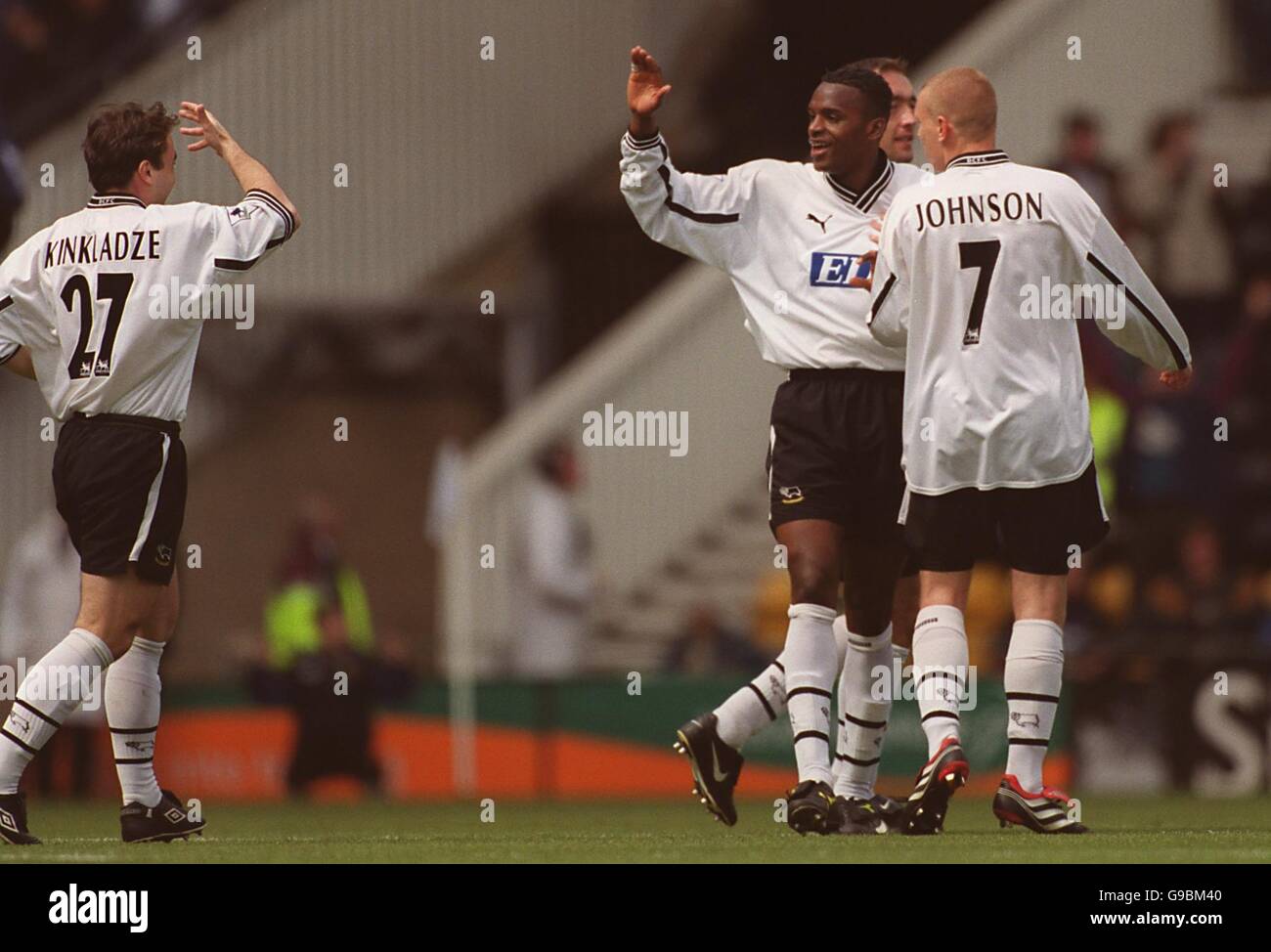 Derby County captain Darryl Powell (c) celebrates scoring the opening ...