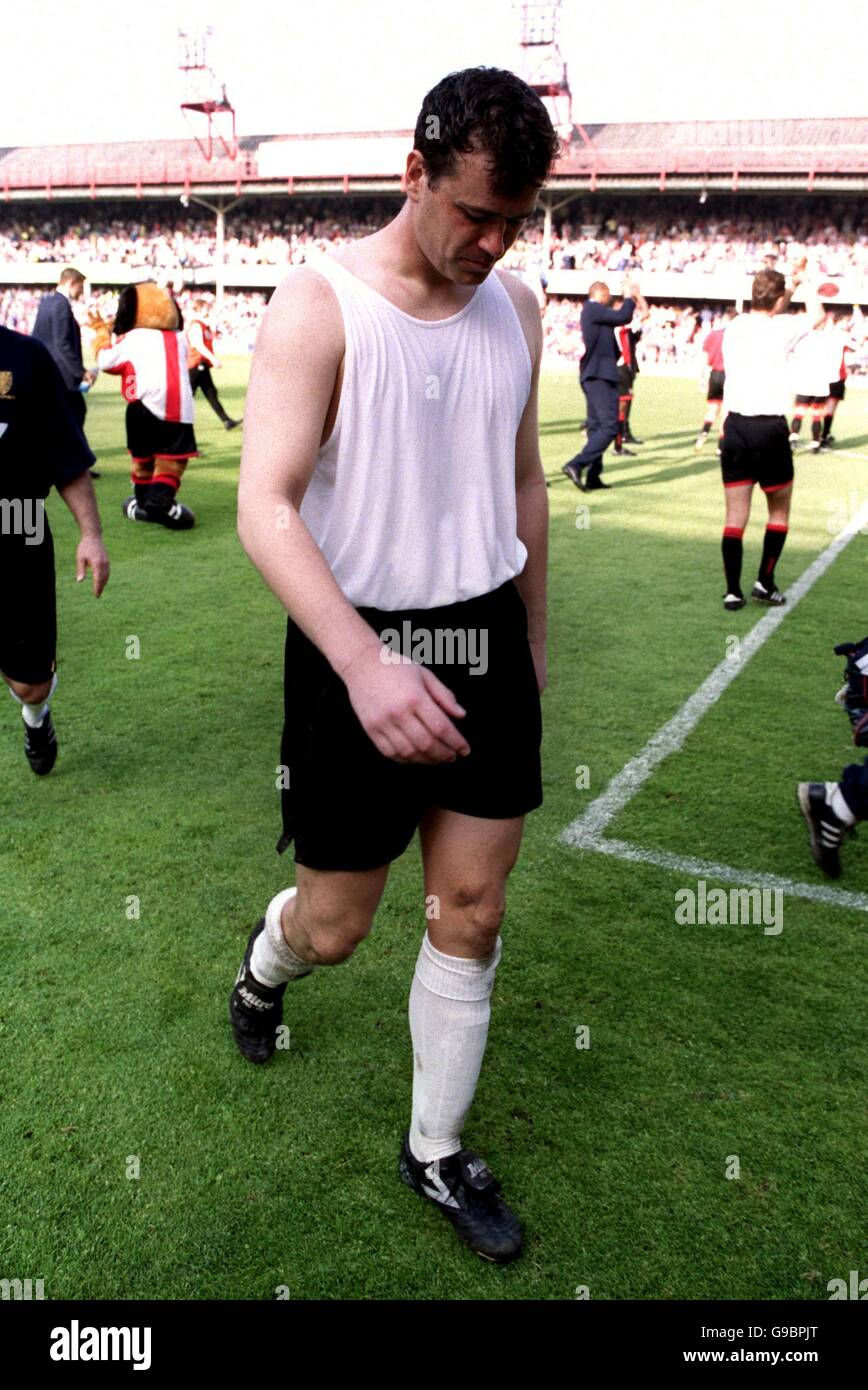Wimbledon goalkeeper Neil Sullivan walks off dejectedly as Wimbledon ...