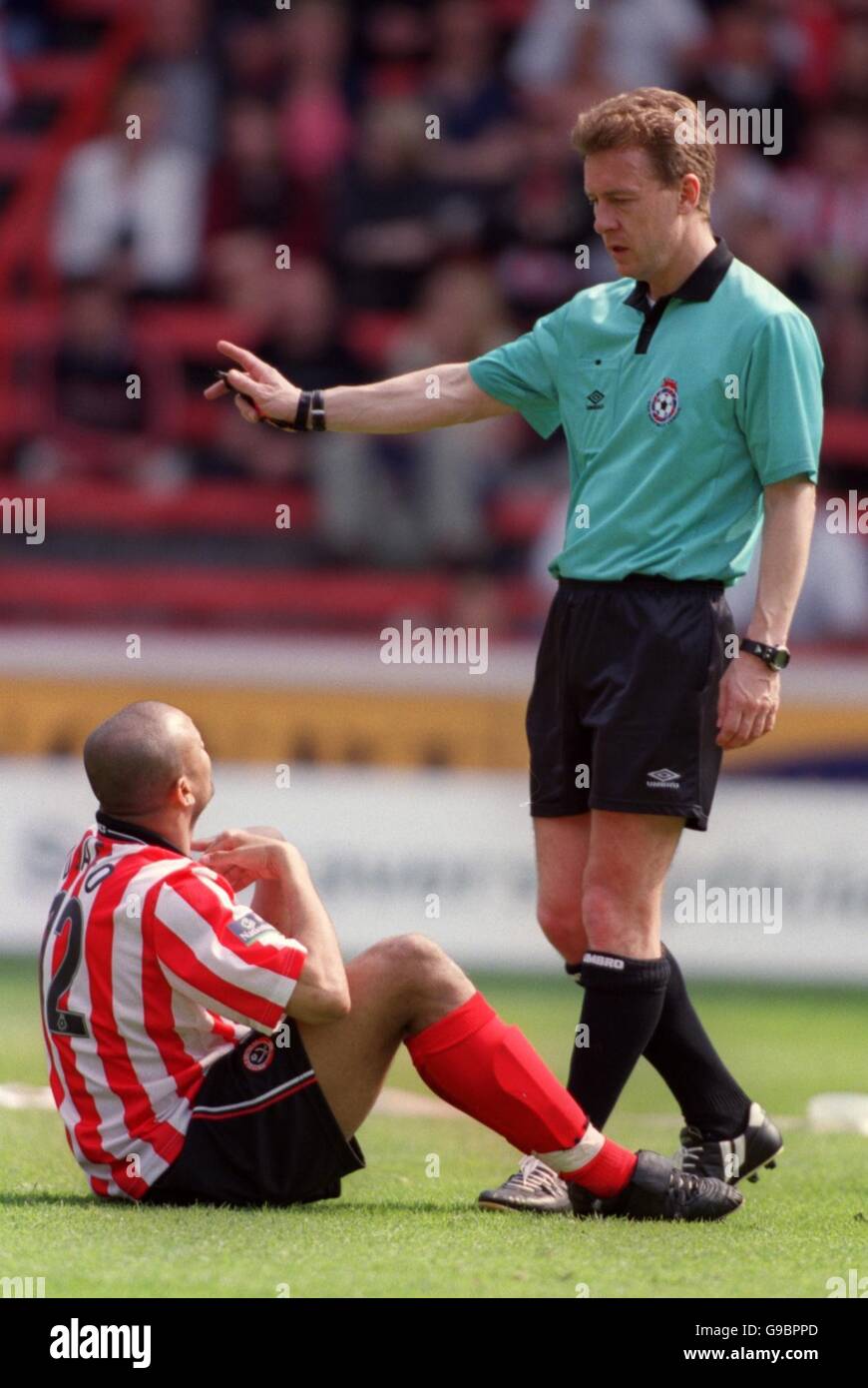 Referee paul taylor tells sheffield uniteds laurent to get up hi-res ...