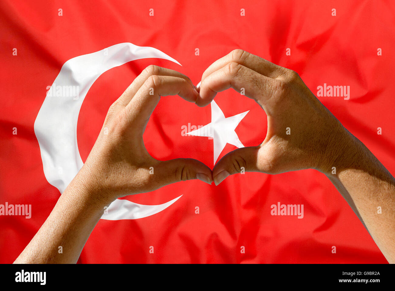 Female hands heart symbol with Turkey flag in background Stock Photo ...