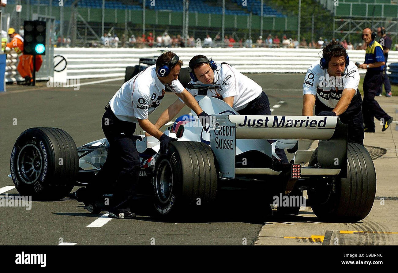 BMW's Jacque Villeneuve displays a 'Just Married' sign on his car after ...
