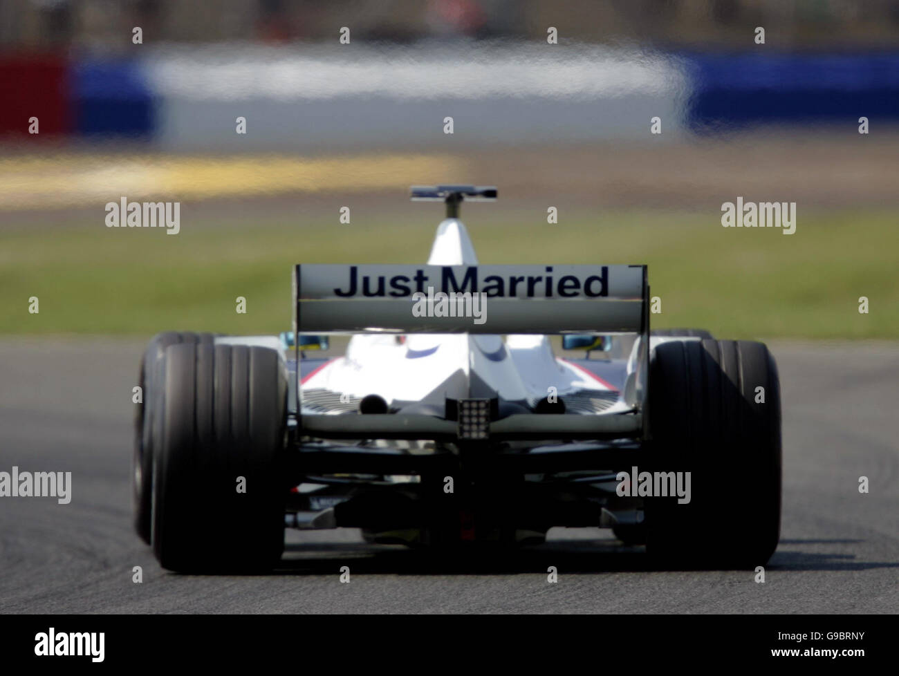 BMW's Jacque Villeneuve displays a 'Just Married' sign on his car after ...