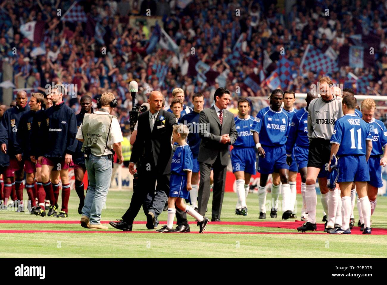 The two teams line up for the national anthem hi-res stock photography ...