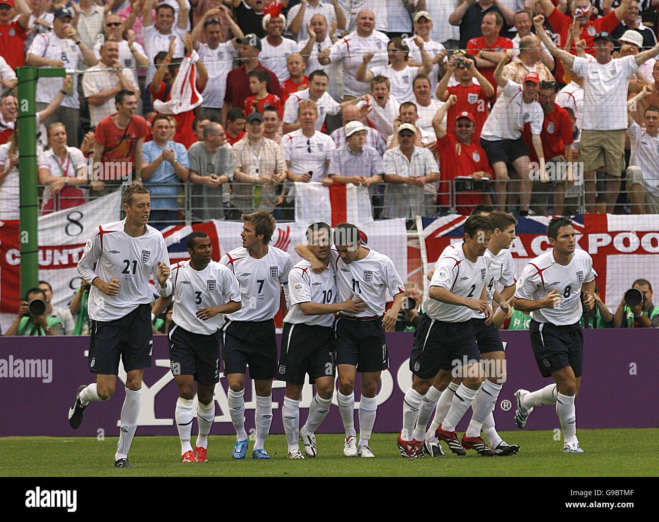England players celebrate a headed own goal by Carlos Gamarra (Paraguay ...