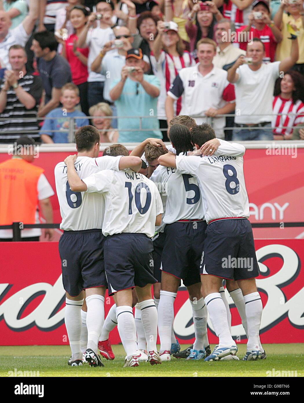 England players celebrate a headed own goal by Carlos Gamarra (Paraguay ...