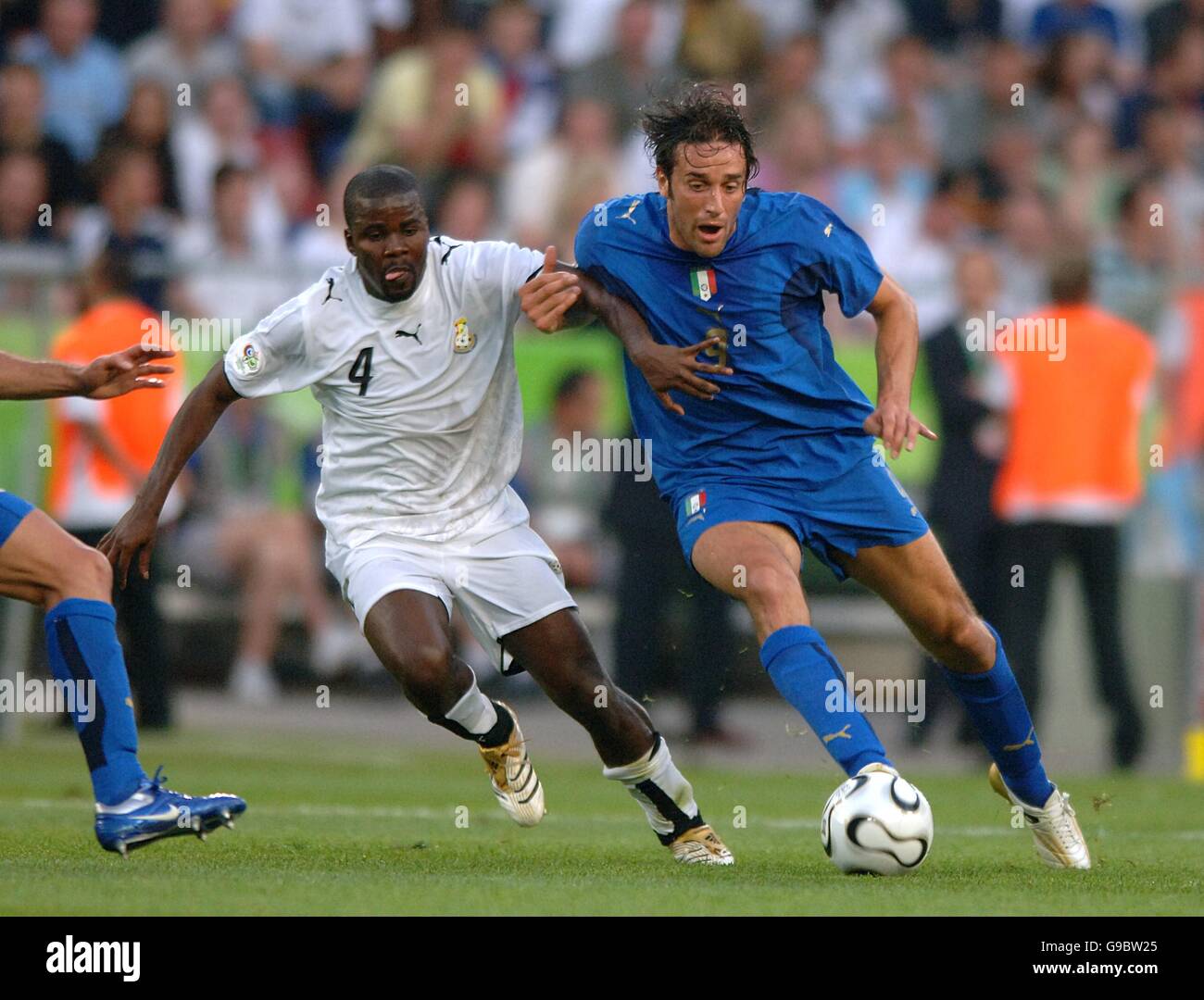 Samuel Kuffour, Ghana and Alberto Gilardino, Italy battle for the ball ...