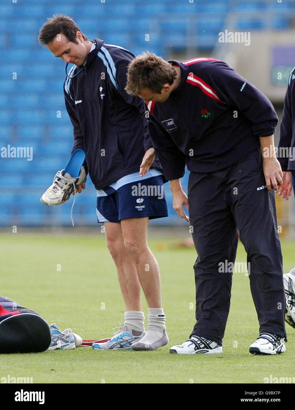 Lancashire's Dominic Cork (R) takes a look at Yorkshire's Michael ...