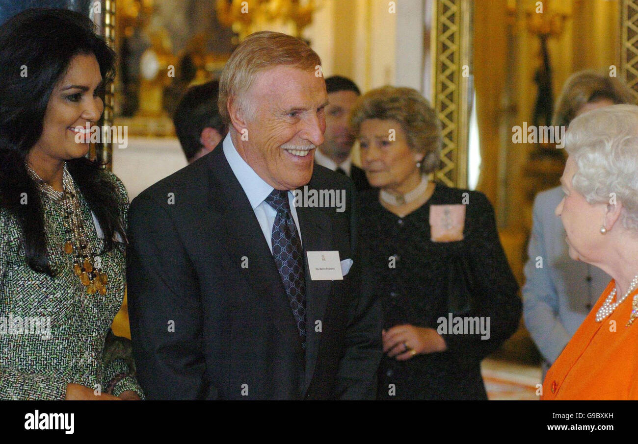 Queen Elizabeth II meets Bruce Forsyth CBE and his wife Winelia (left ...