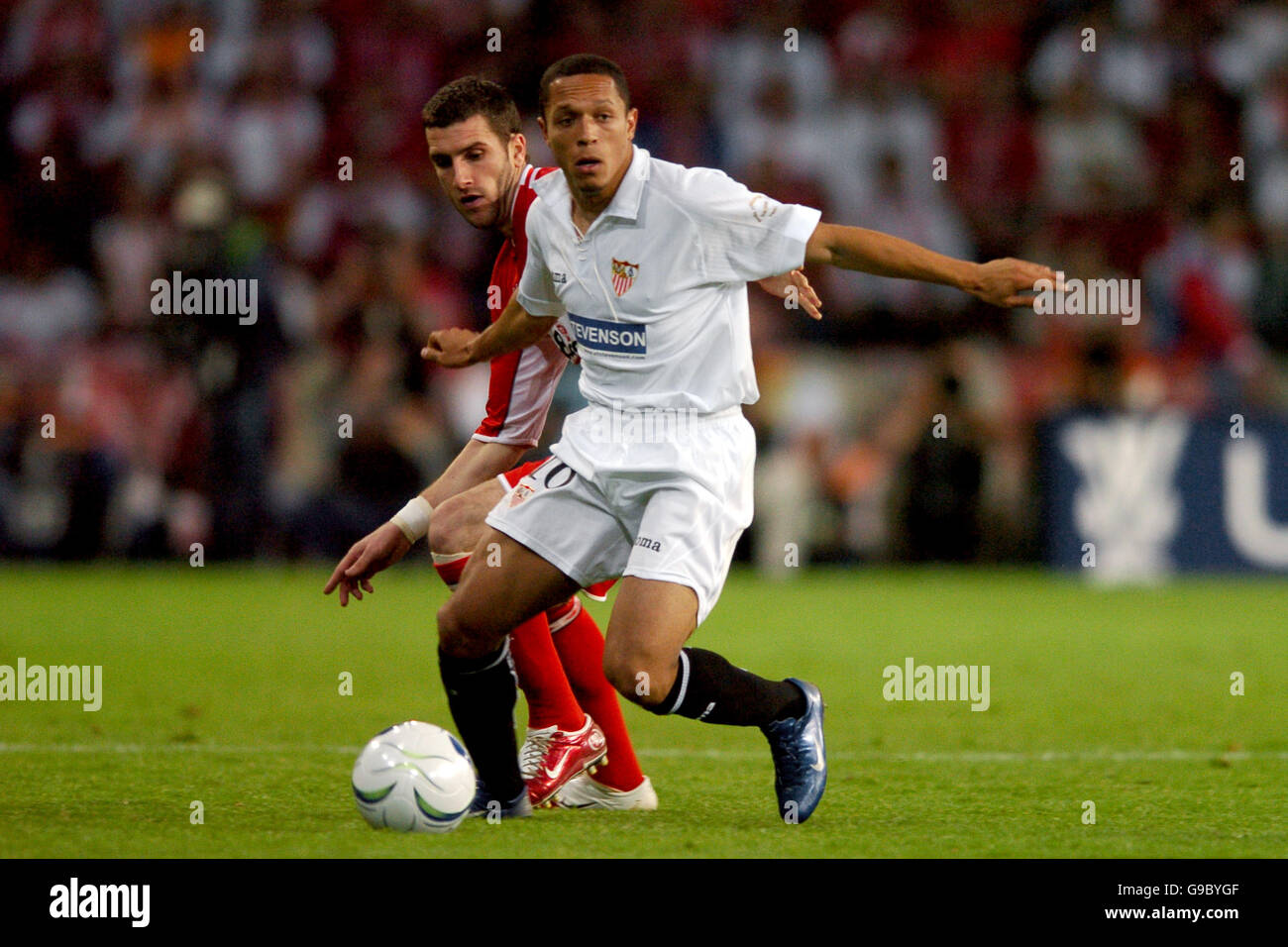 Middlesbroughs stuart parnaby sevilles luis fabiano battle for the ball ...