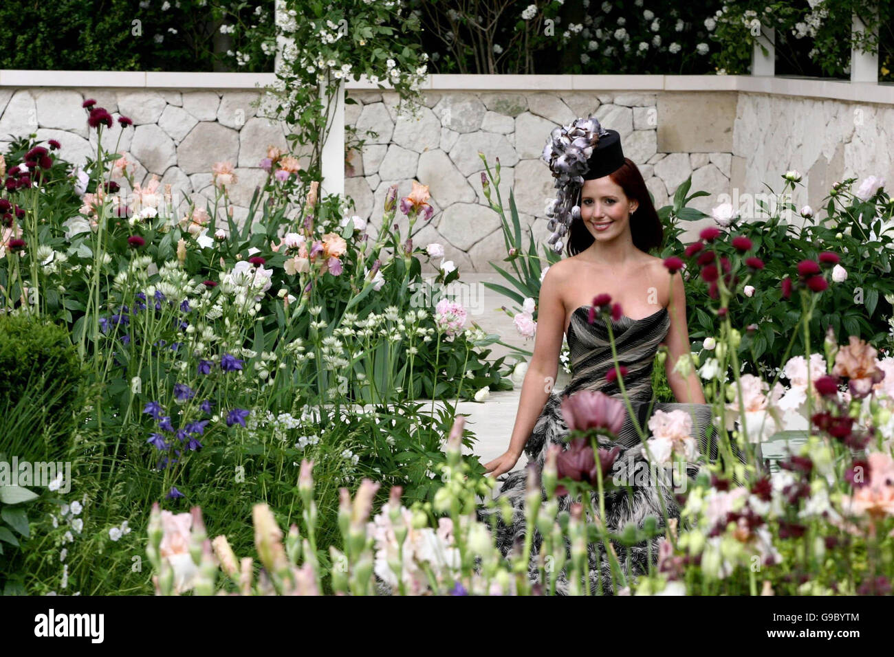 Actress Amy Nuttall wears a Jasper Conran dress and a Cozmo hat in the ...