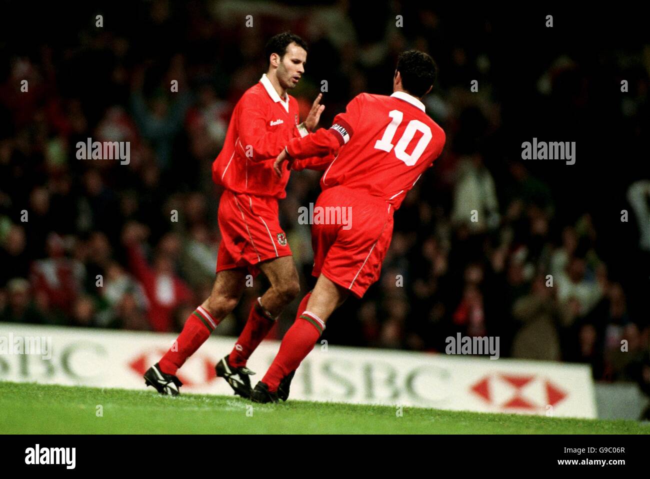 Wales's Ryan Giggs (l) celebrates with Gary Speed (r) after scoring to ...