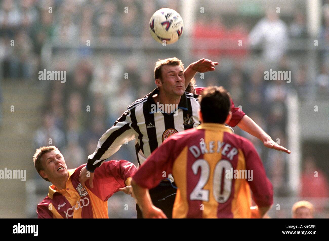 Newcastle United's Duncan Ferguson (c) is challenged in the air by ...