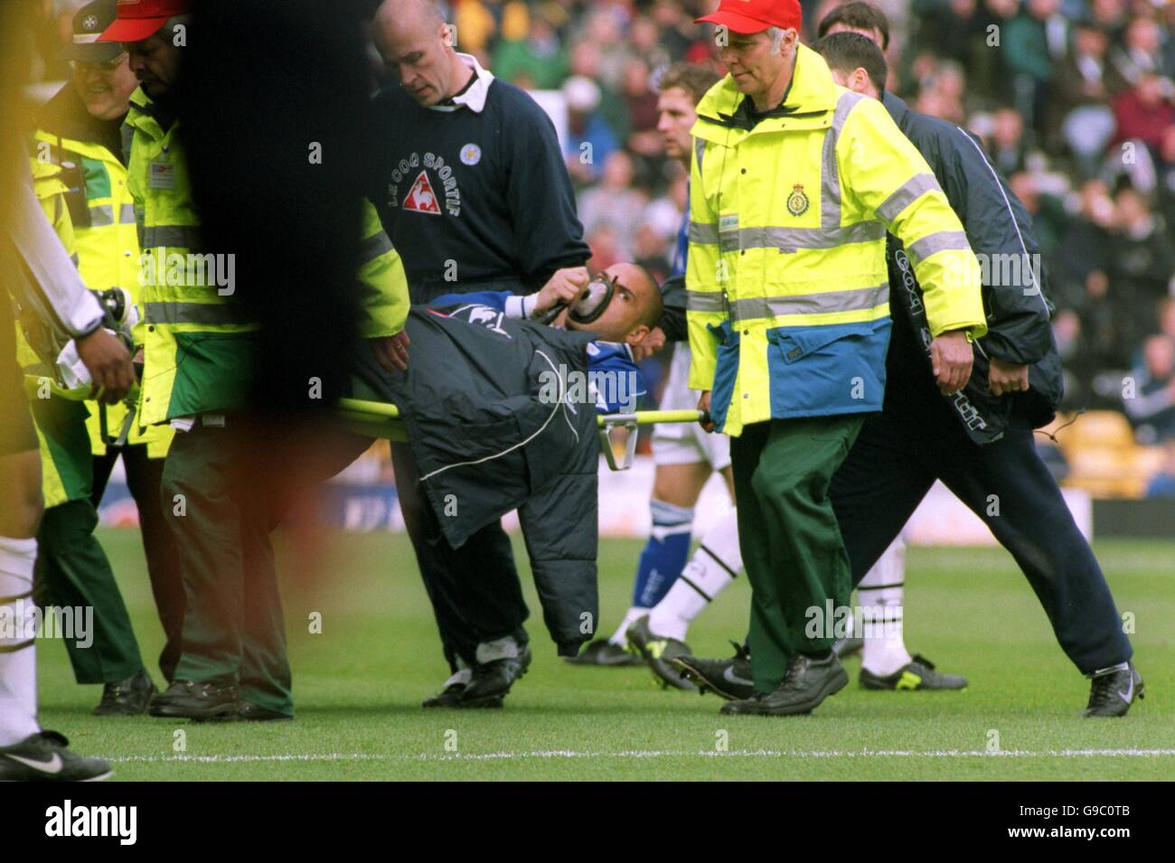 Leicester City's Stan Collymore is stretchered off with a broken leg ...