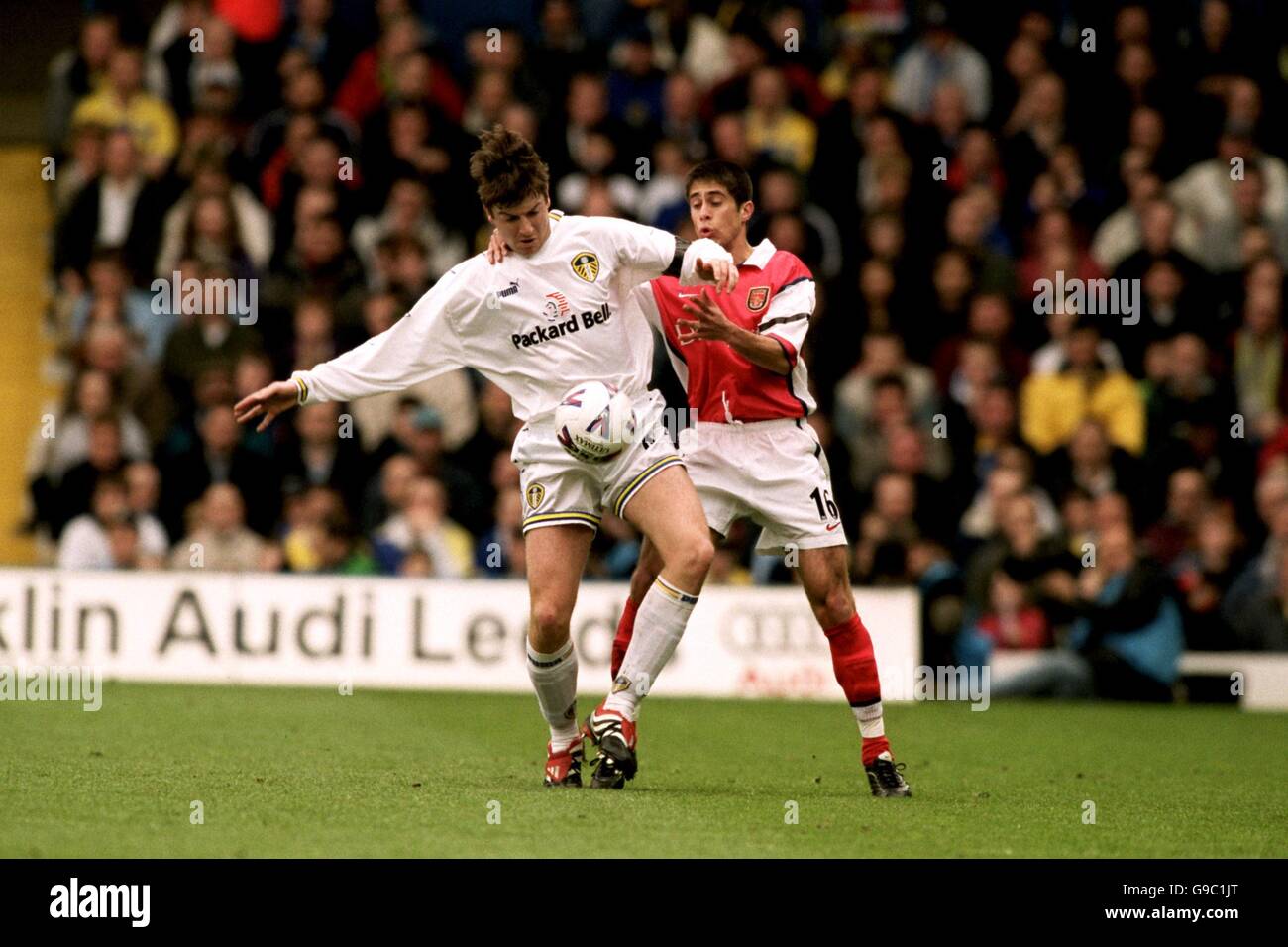 Leeds United's Michael Bridges (l) shields the ball from Arsenal's ...