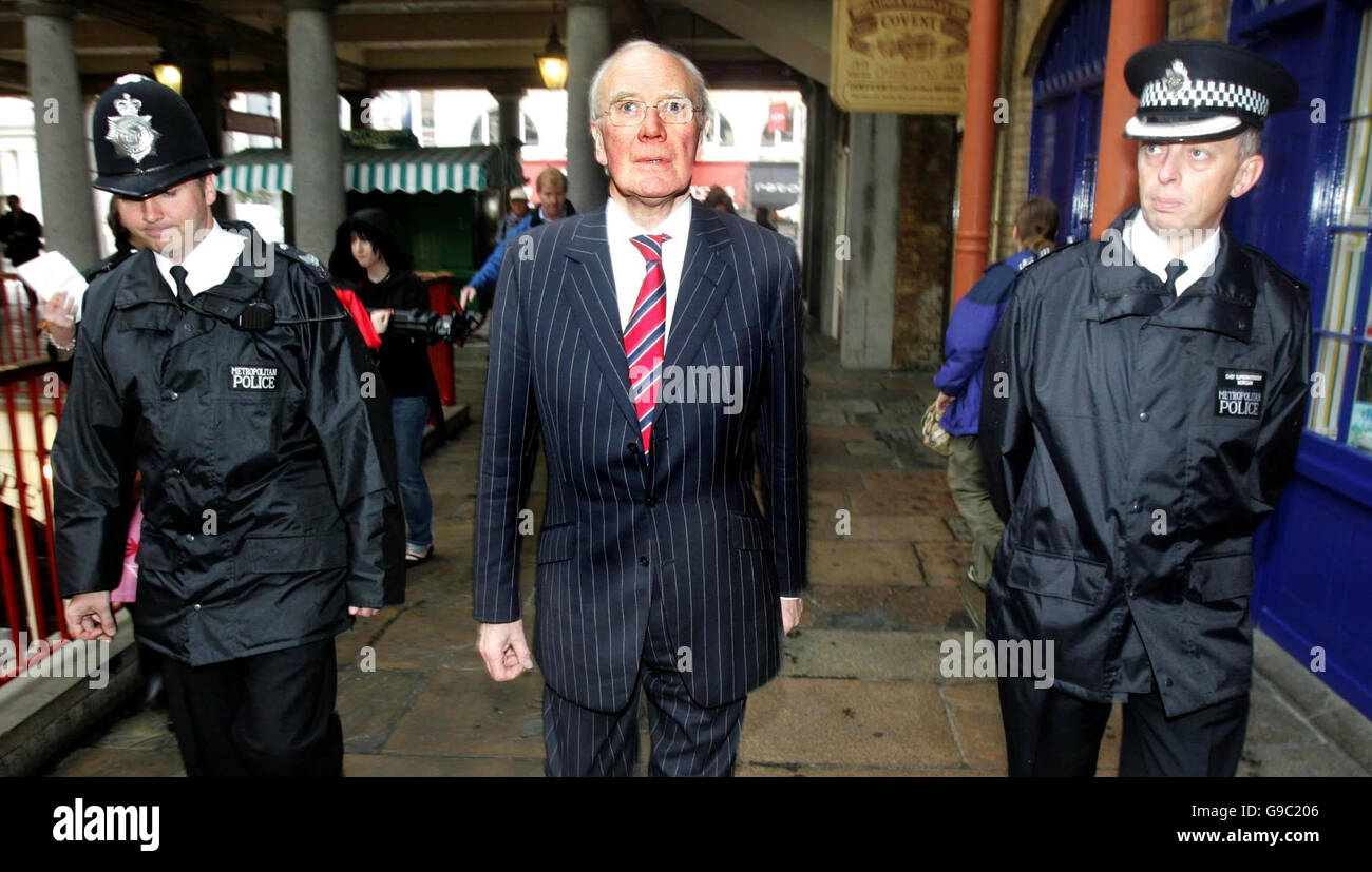 Sir Menzies Campbell walks with Sergeant Alan Sweetman (left) and Chief ...