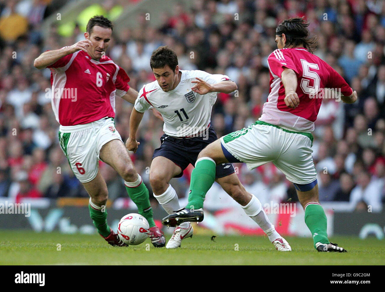 England's Joe Cole goes past Hungary's Laszlo Eger (R) and Balazs ...