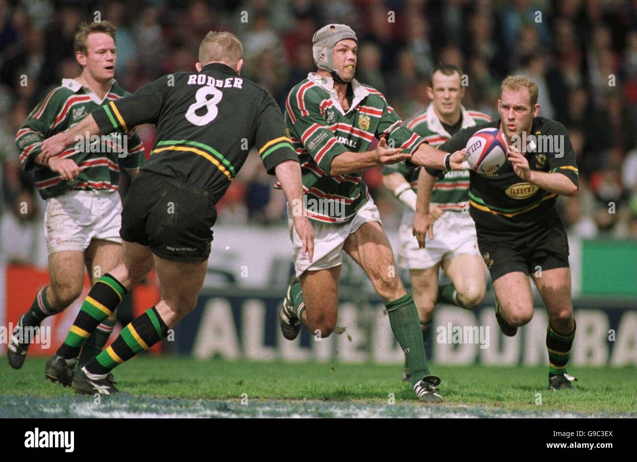 Northampton's Tim Rodber (l) charges towards Leicester's Fritz van ...