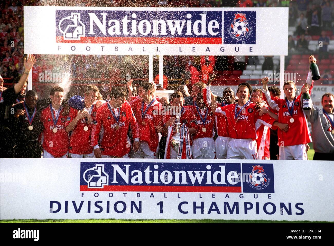 Champagne champions team group trophy football hi-res stock photography ...