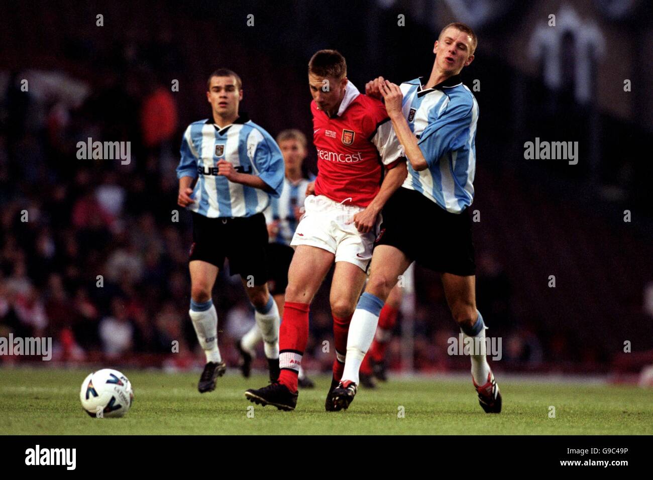 Arsenal's David Noble holds off Coventry City's Thomas Cudworth Stock ...