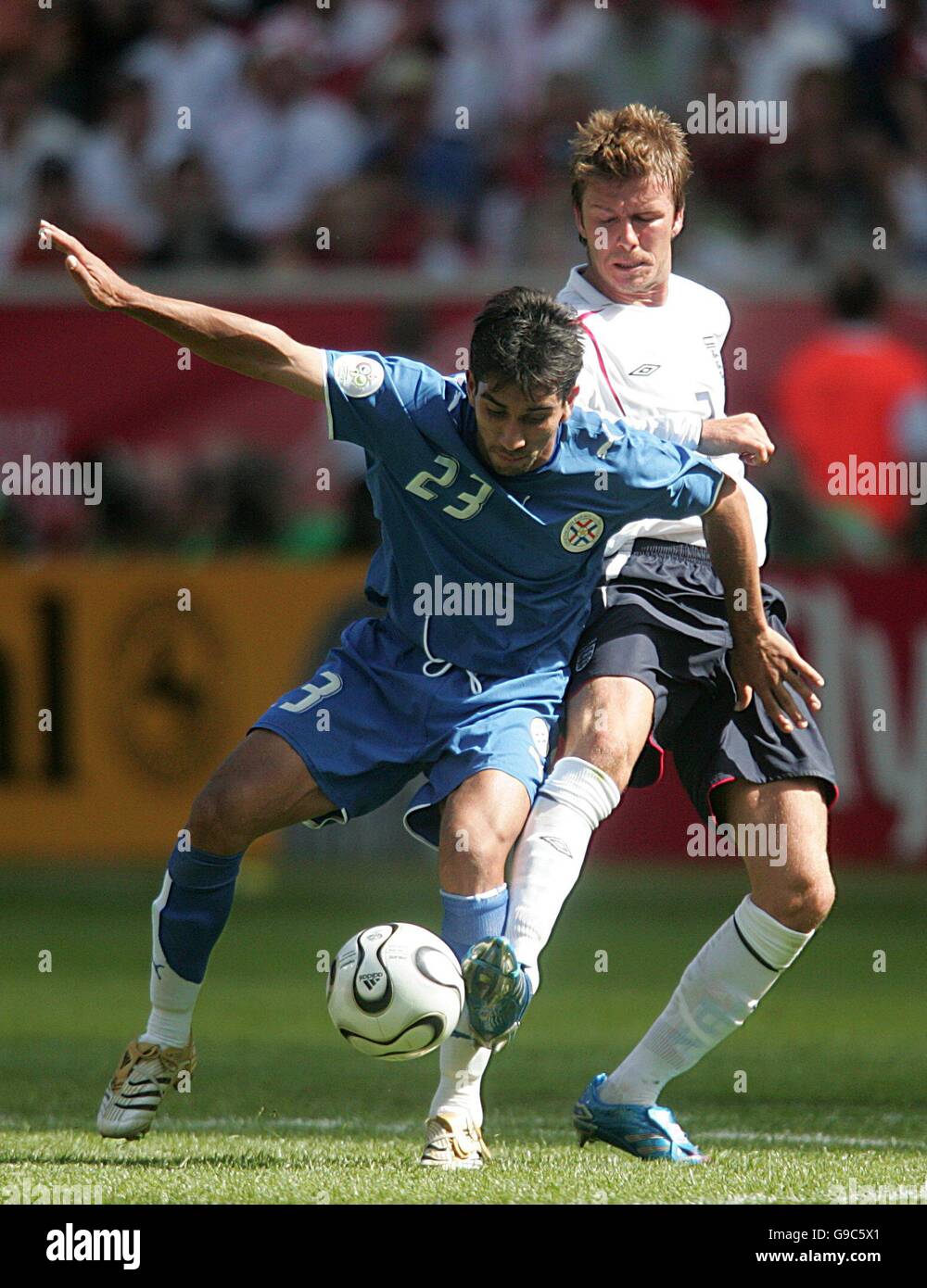 (L-R) Paraguay's Nelson Cuevas and England's David Beckham Stock Photo ...