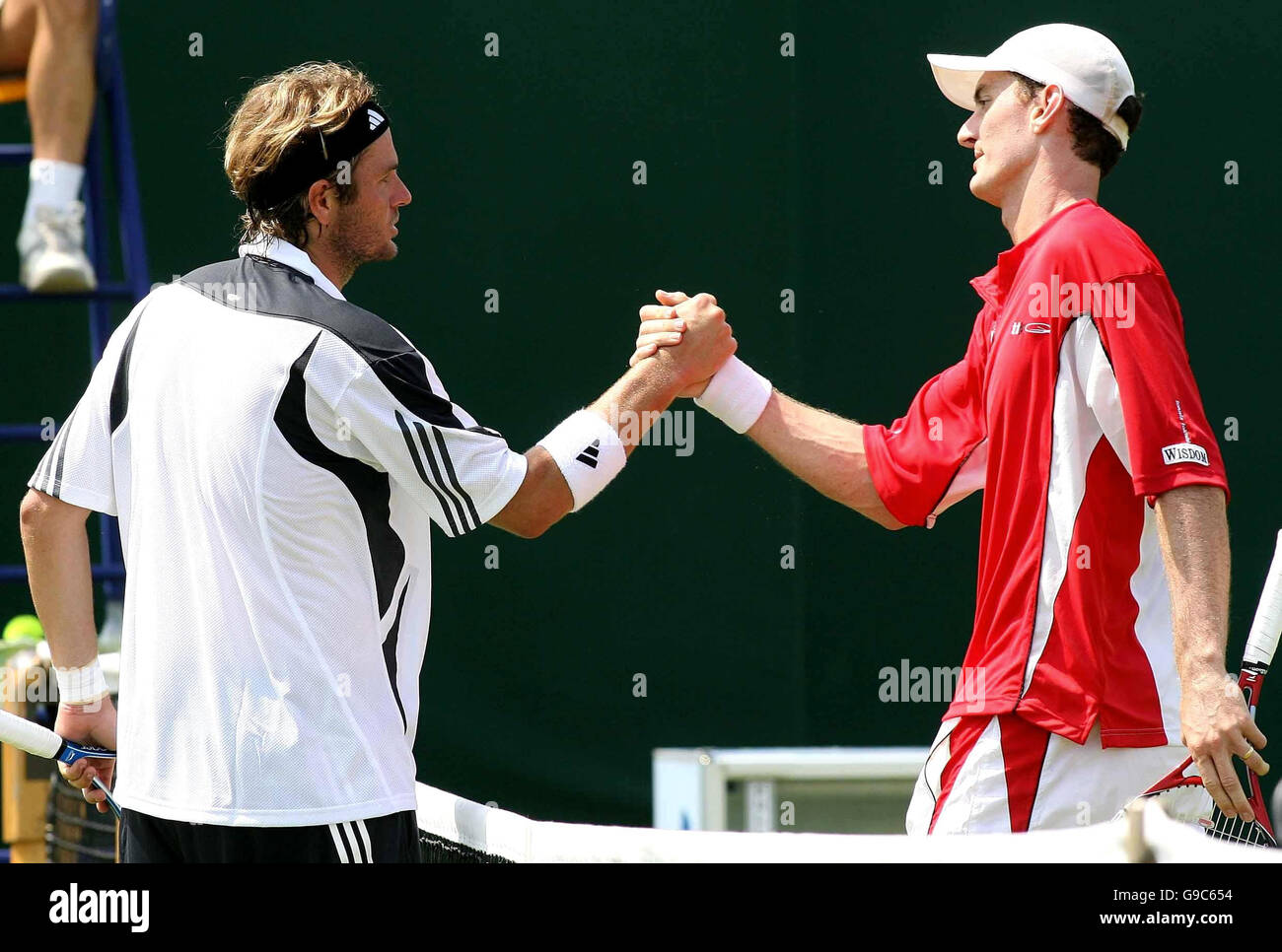 South Africa's Wesley Moodie (right) congratulates USA's Mardy Fish ...