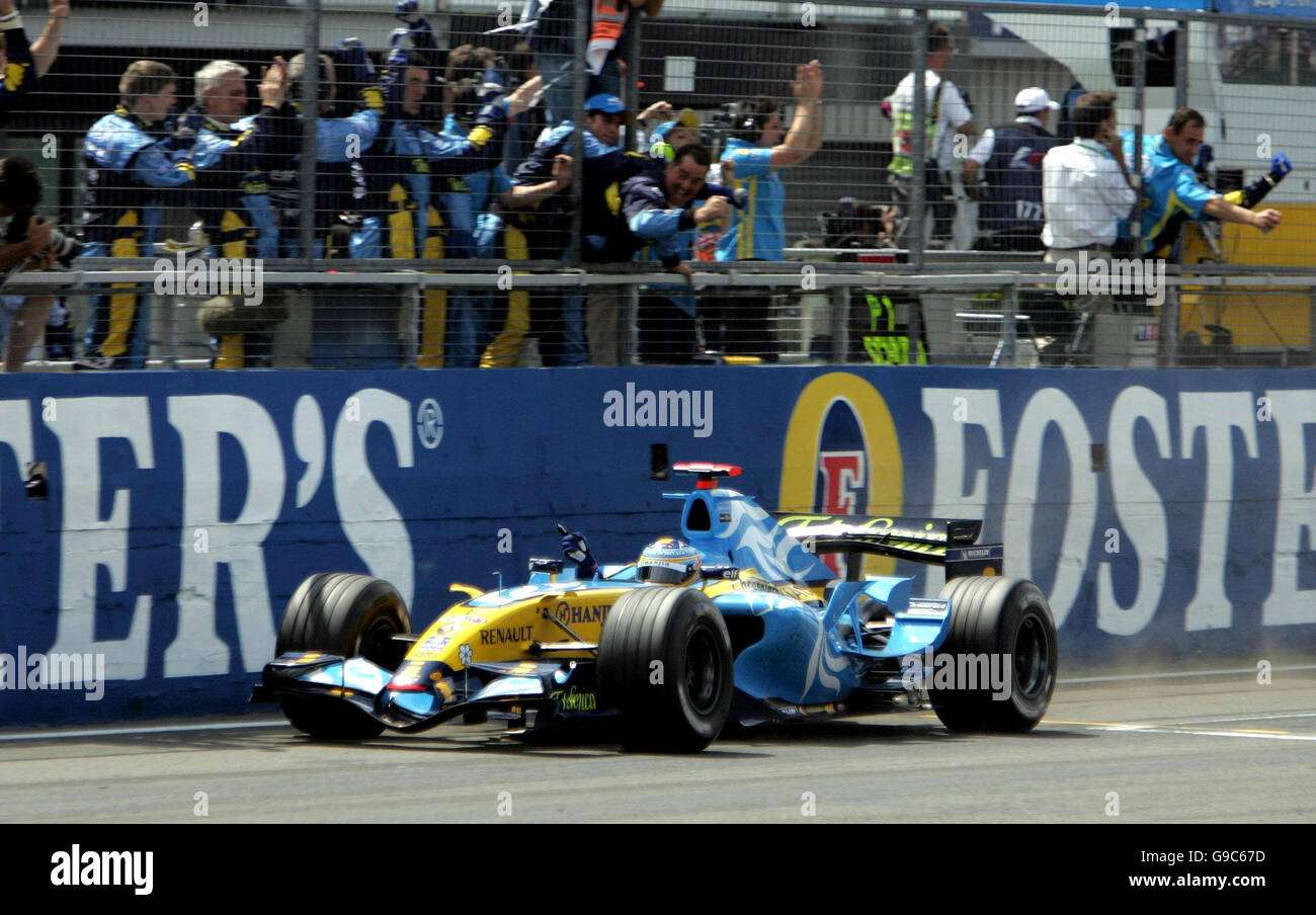 Spain's Fernando Alonso in his Renault celebrates with his team (top ...