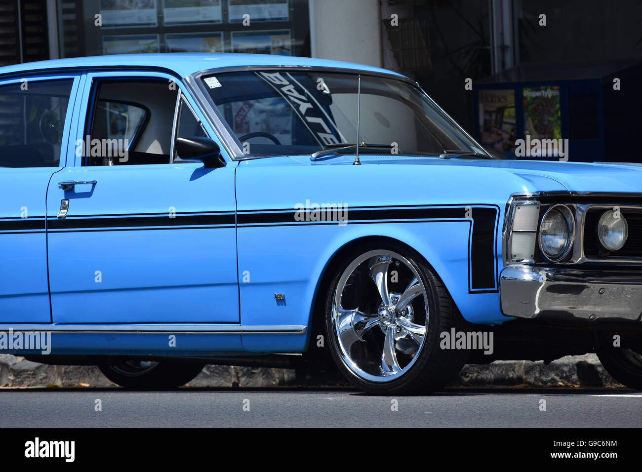Bright blue retro muscle car Stock Photo - Alamy