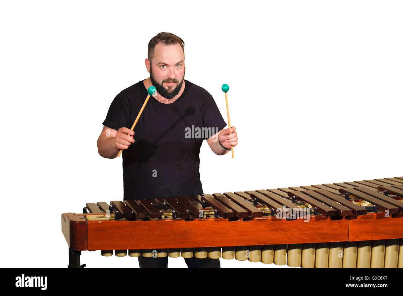 One man with a beard play on the percussion music instruments.isolated ...