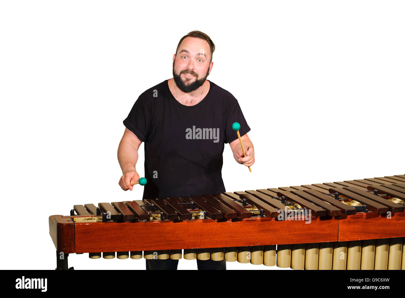 One man with a beard play on the percussion music instruments.isolated ...