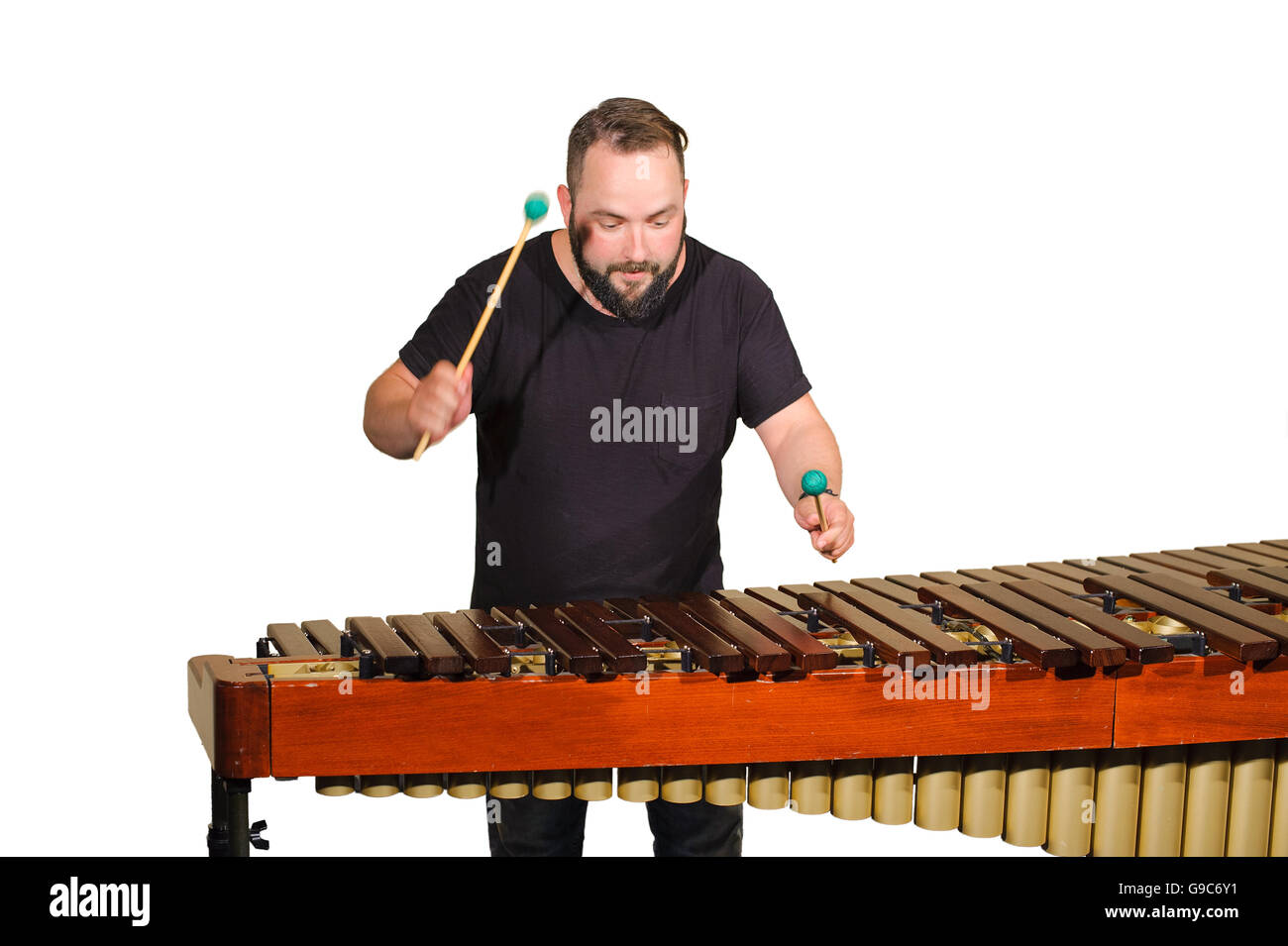 One man with a beard play on the percussion music instruments.isolated ...