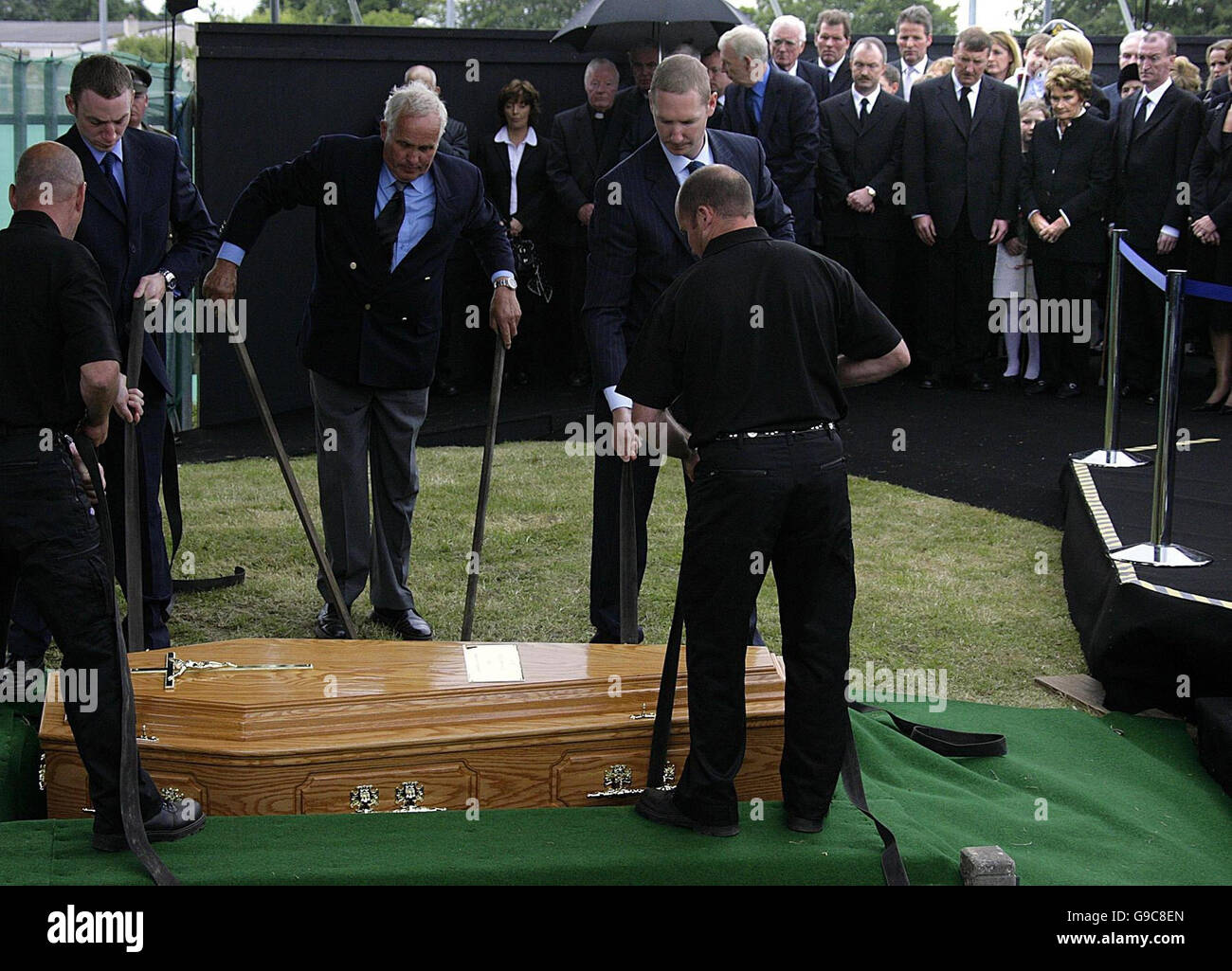 The coffin of the late Taoiseach Charlie Haughey being lowered into the ...