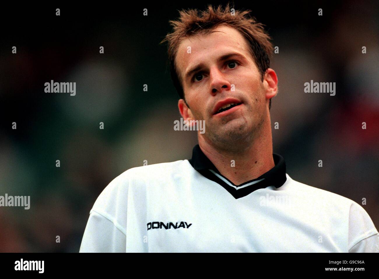 A shell shocked Greg Rusedski after losing his first round match with ...
