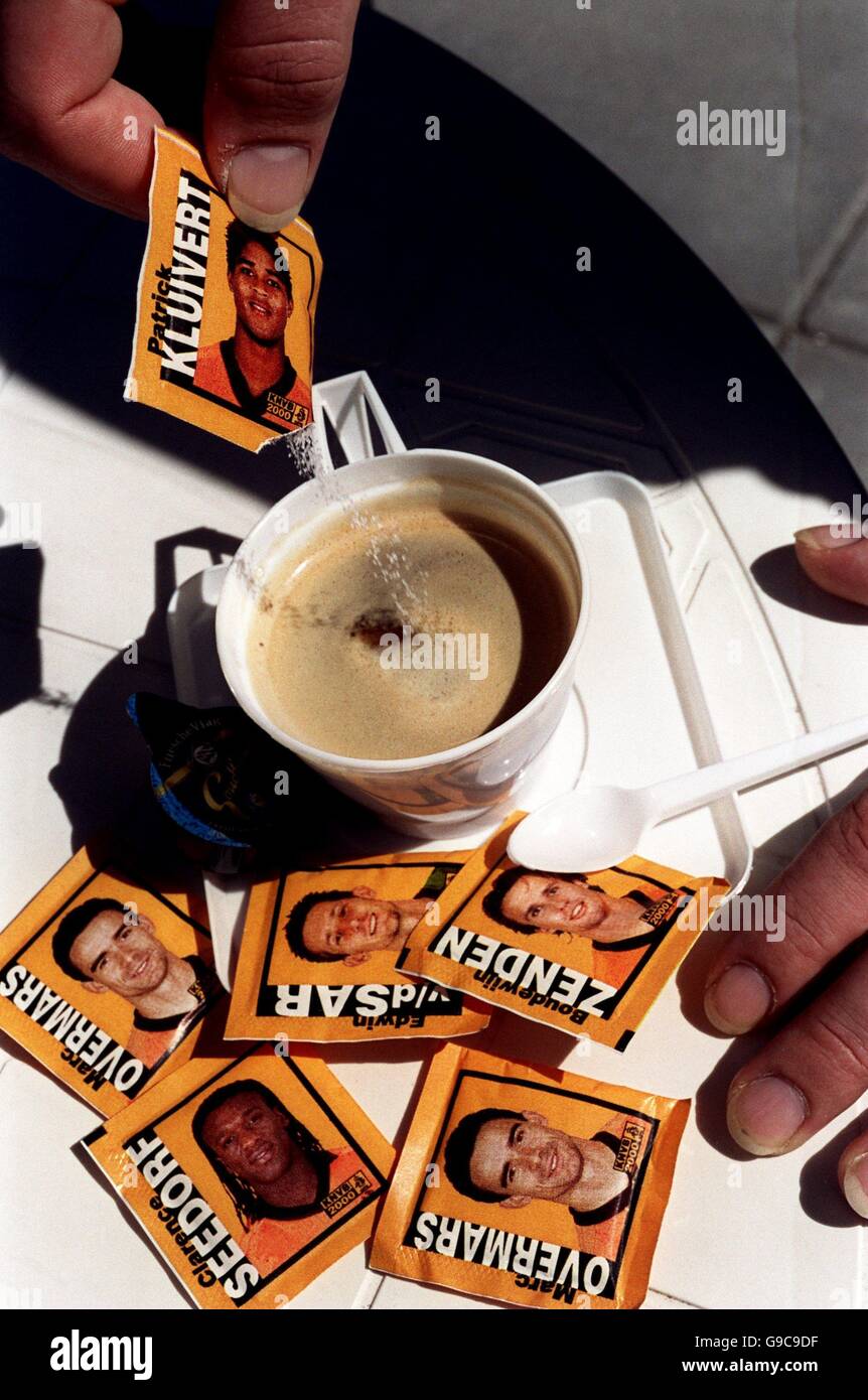 A Dutch waiter makes coffee with Patrick Kluivert sugar, in the Dutch ...