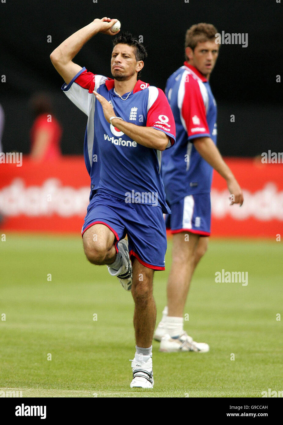 England bowler Sajid Mahmood is watched by fellow pace bowler Liam ...