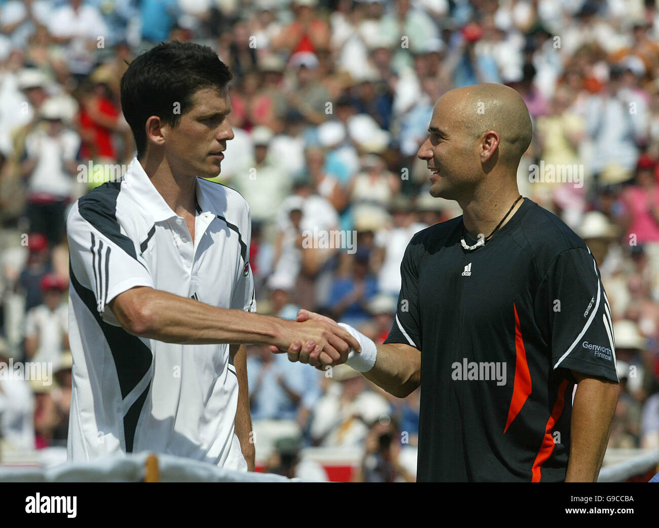Great Britain's Tim Henman shakes hands with USA's Andre Agassi after ...