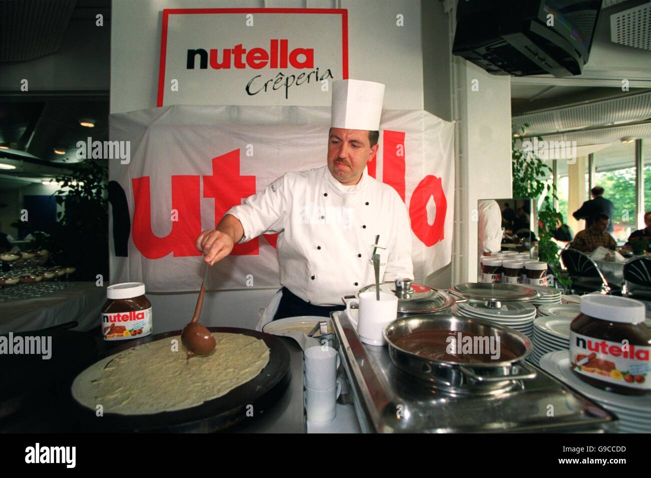 Nutella chocolate spread is served up to hungry guests hi-res stock ...