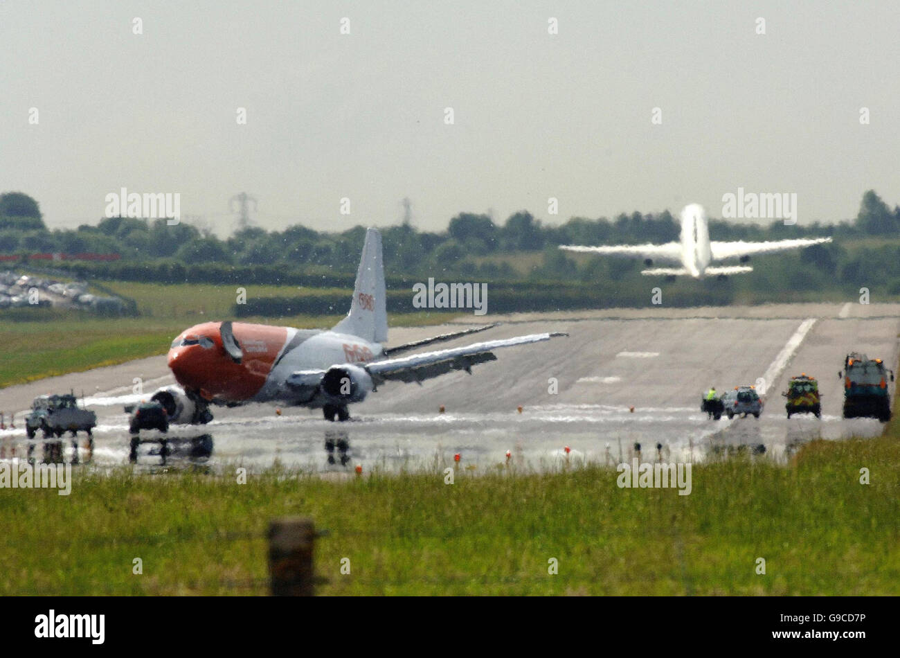 Retransmission, correcting catchline. A TNT cargo plane lies damaged as ...