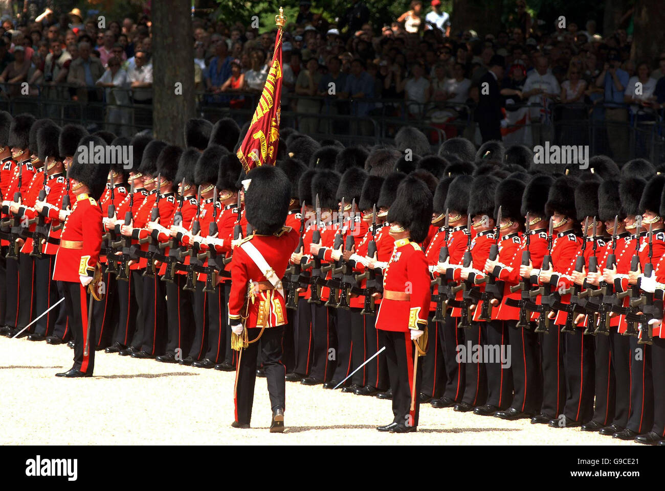 The Colour (flag) is marched in front of the Coldstream Guards, during ...