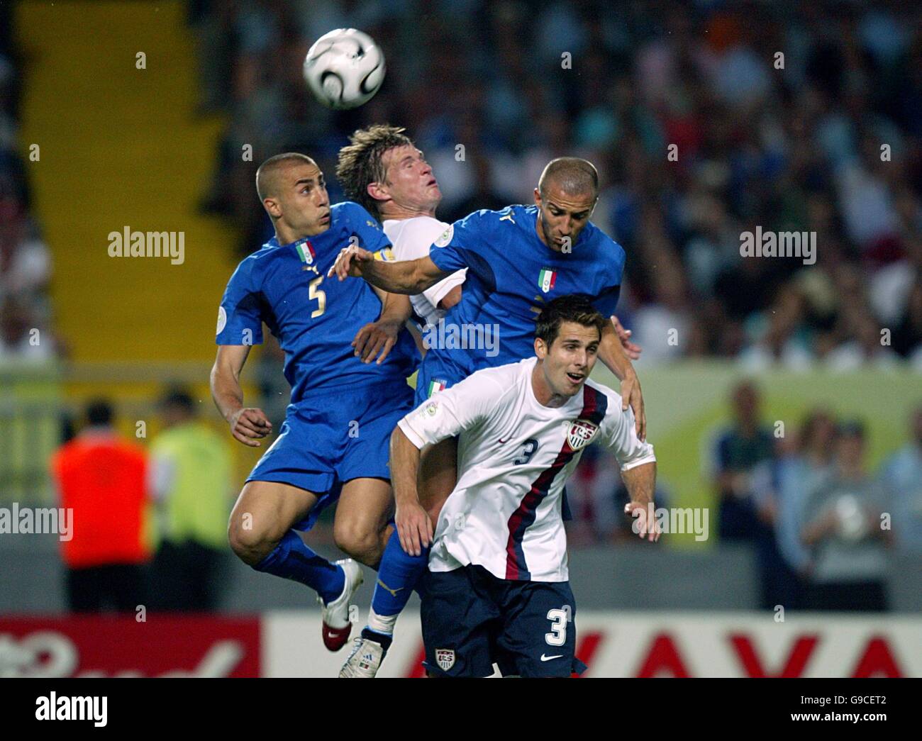 Italys fabio cannavaro gets above usas brian mcbride carlos bocanegra ...