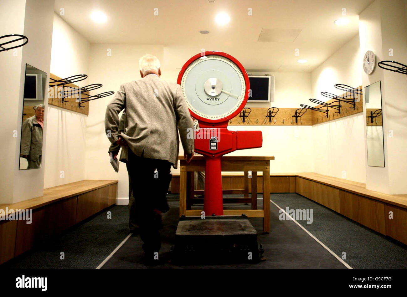 A course official inspects the female jockey's weighing room, as final ...