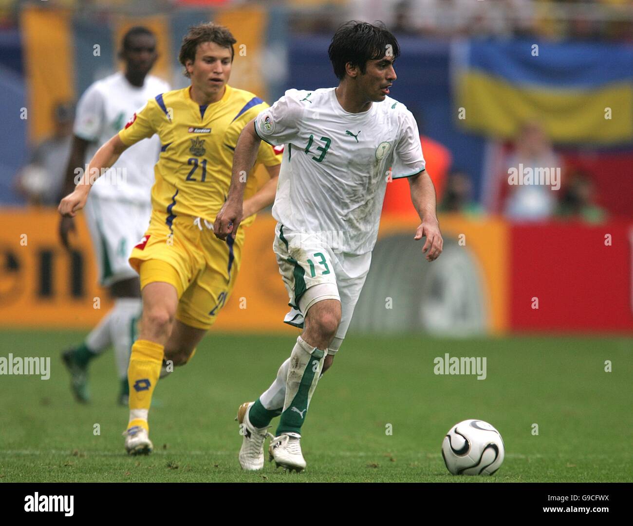 Hussein Sulimani, Saudi Arabia (r) takes the ball passed Ruslan Rotan ...