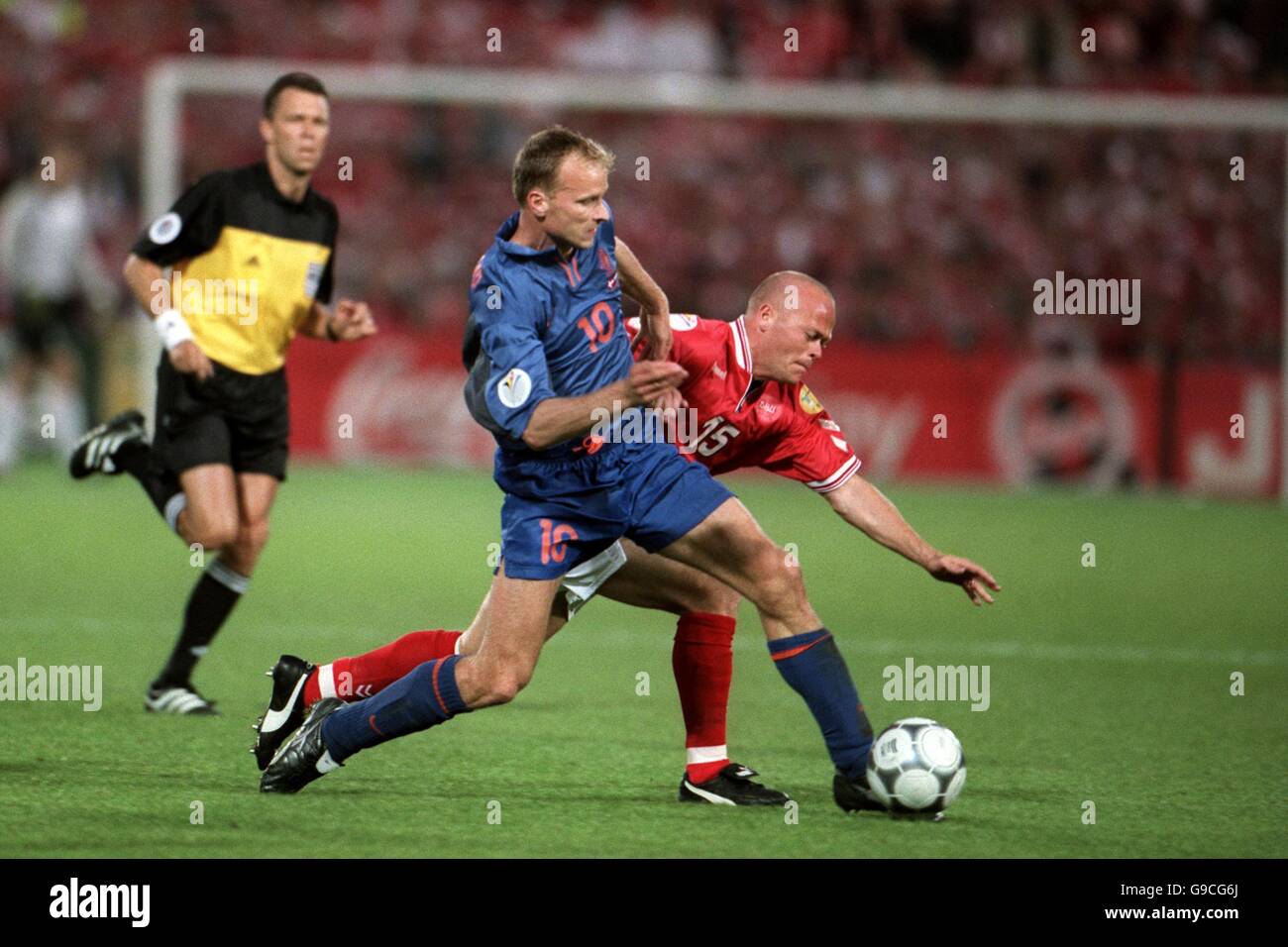 Holland's Dennis Bergkamp (l) tangles with Denmark's Stig Tofting (r ...