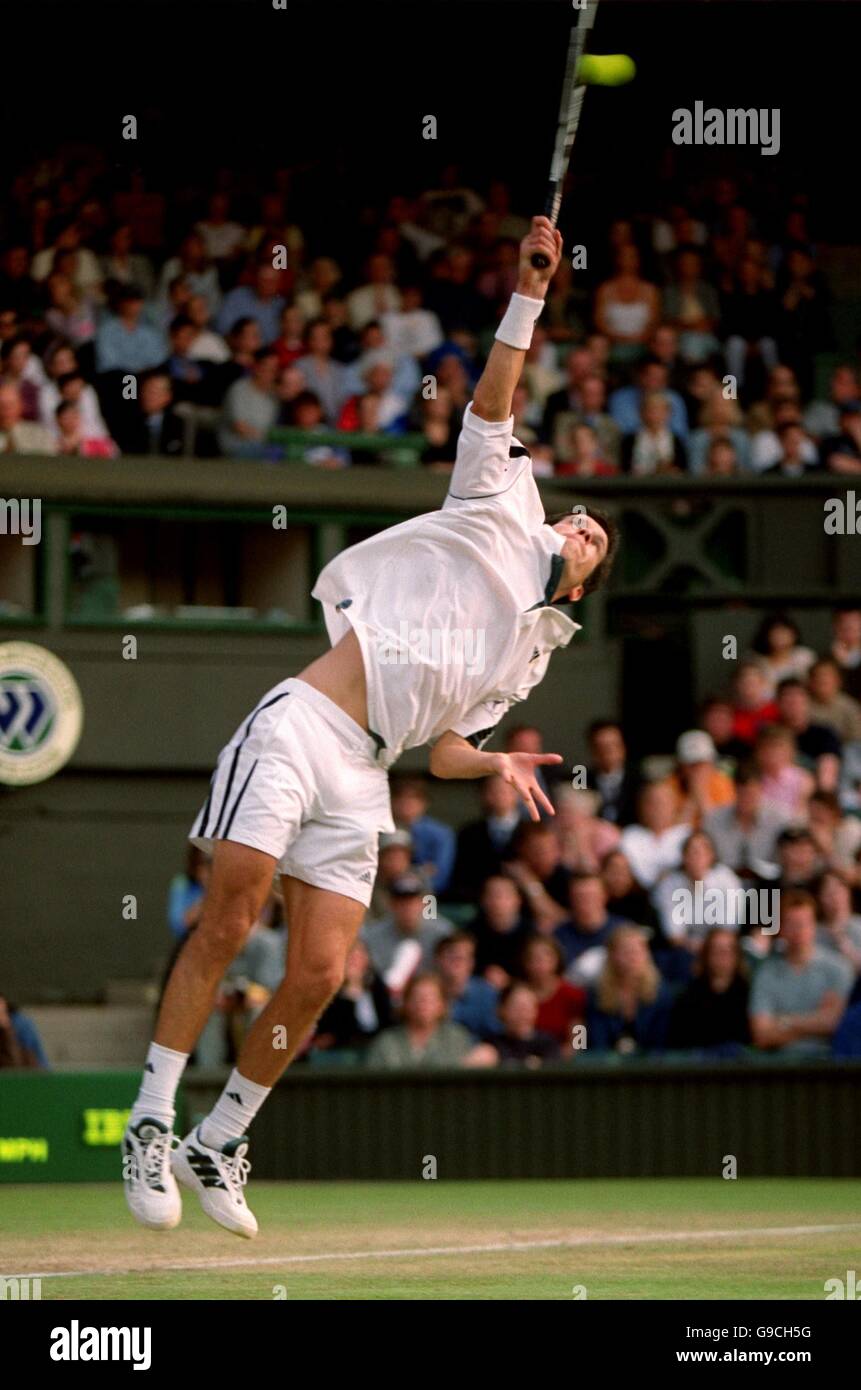 Tennis - Wimbledon Championships - Third Round. Tim Henman serving ...