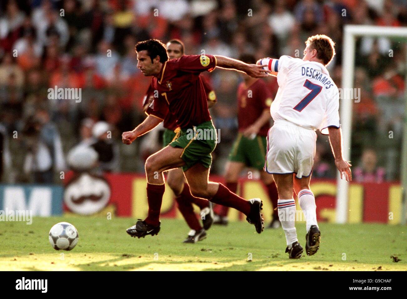 Portugals luis figo l surges past frances didier deschamps r hi-res ...