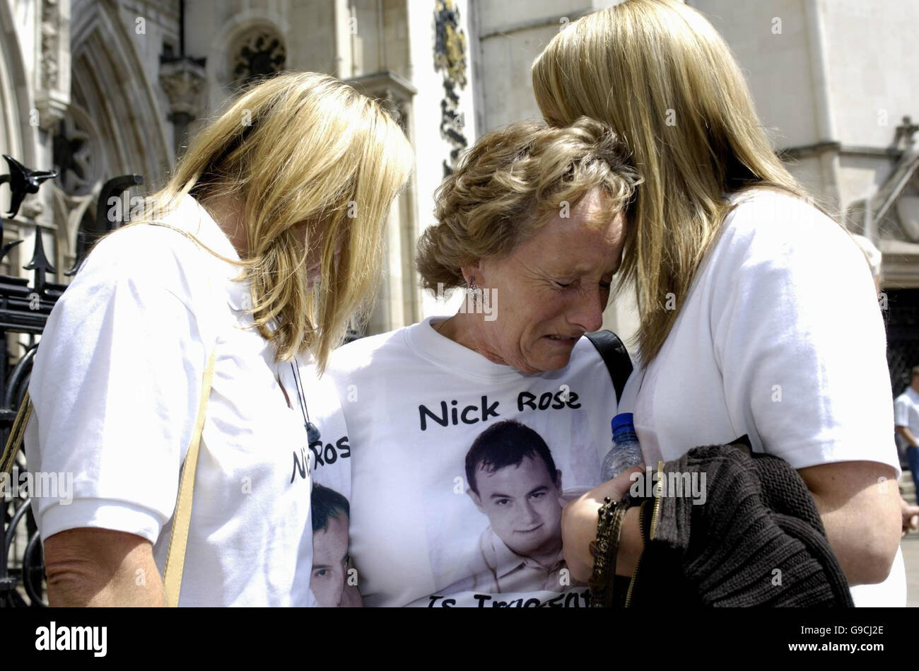 Doris Brown is comforted by her family after hearing that her grandson ...