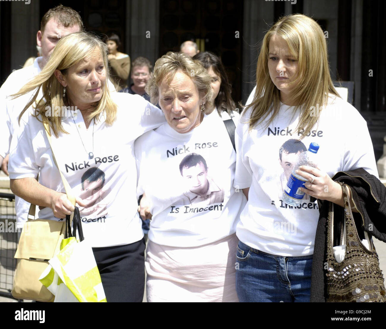 Doris Brown is comforted by her daughter Kay Rose, left, and ...