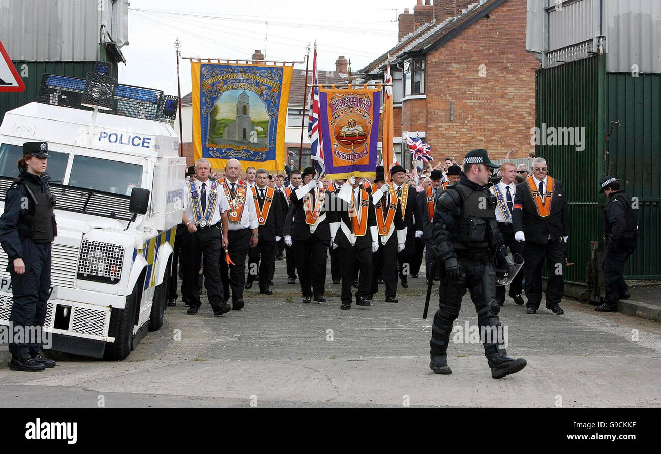 Police open security gates on the Springfield road in Belfast to allow ...