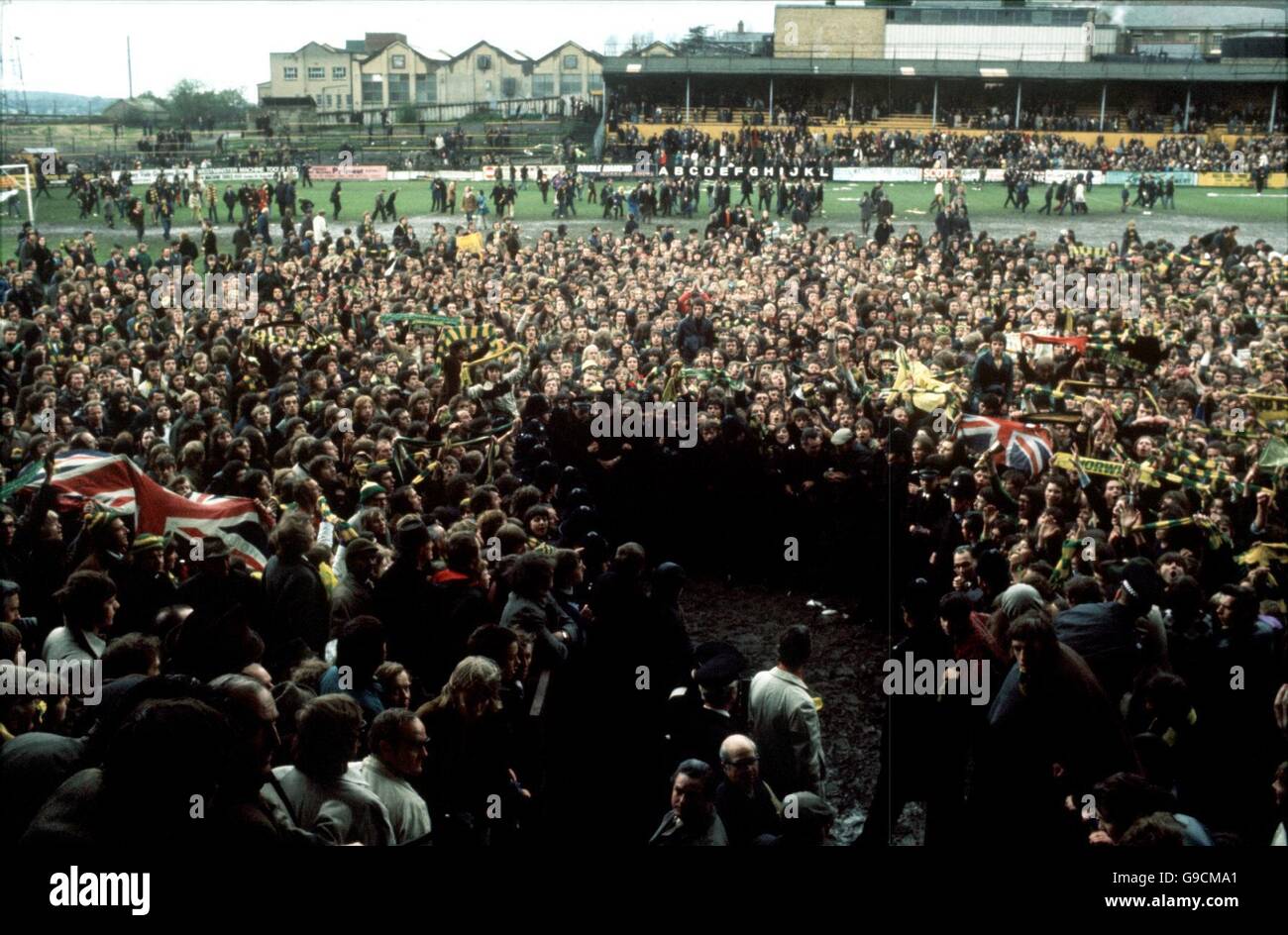 Norwich City fans invade the Vicarage Road pitch after seeing their ...